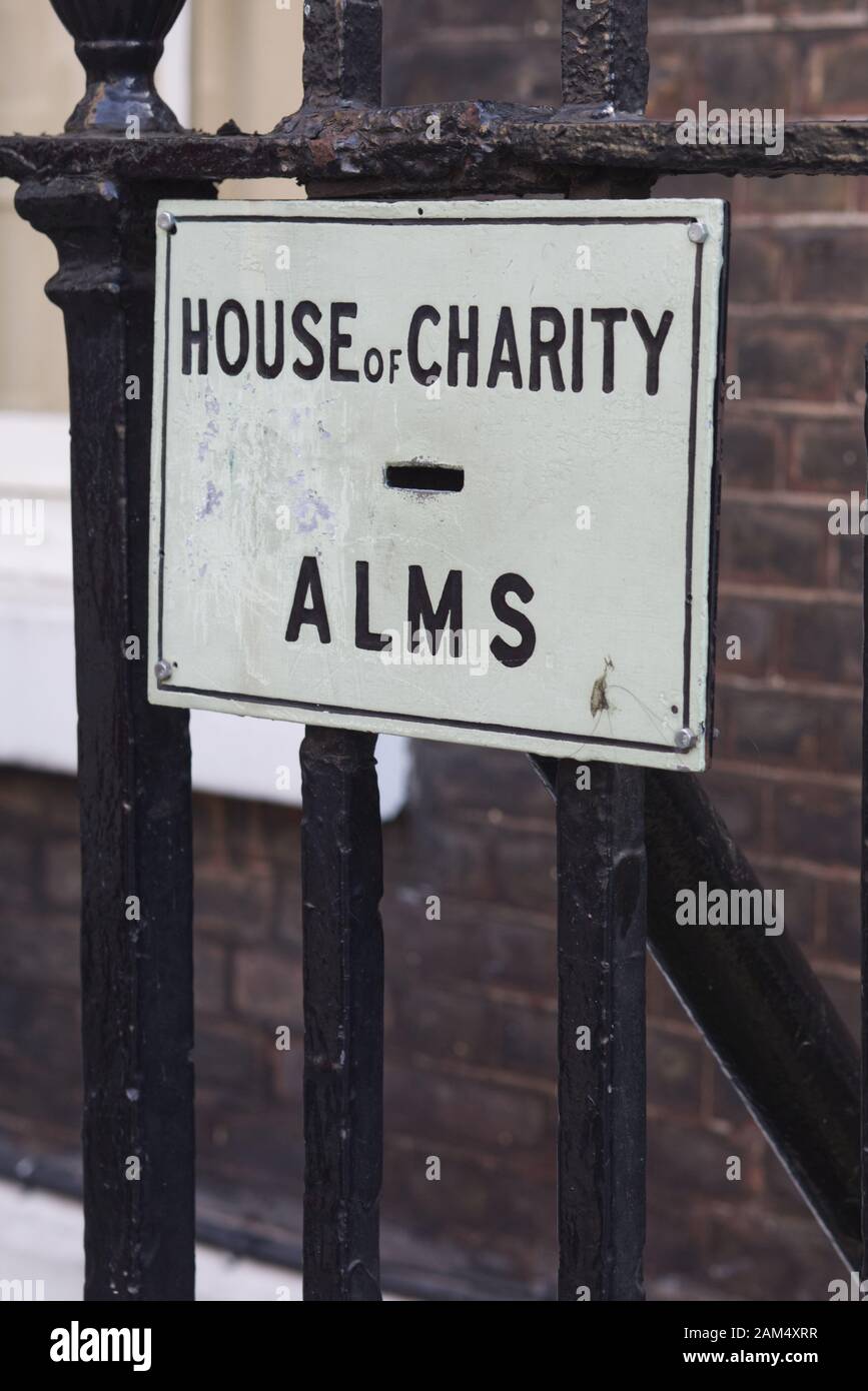 house of charity collection pipe, Alms, The Penny Chute Stock Photo - Alamy
