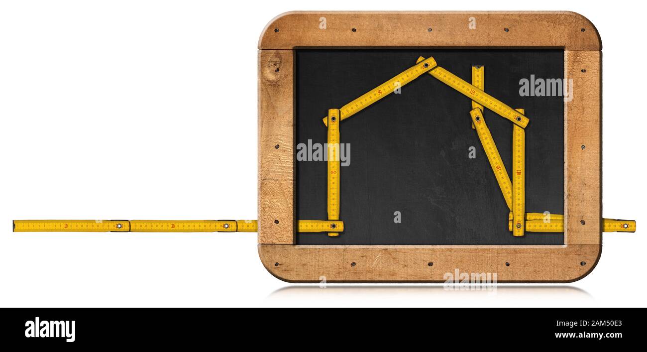 Yellow wooden folding ruler in the shape of a house in a blackboard ...