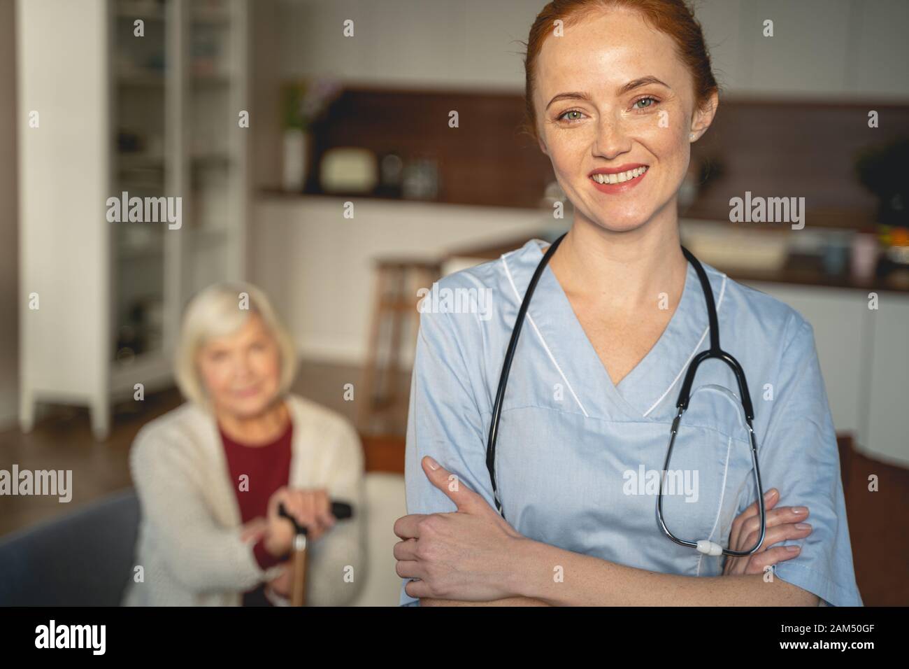 Cheerful brunette medical worker demonstrating her smile Stock Photo ...