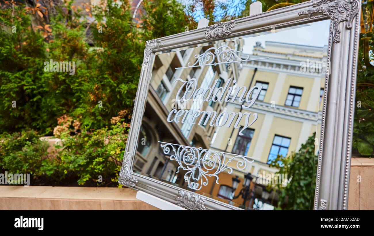 Wedding Ceremony Sign On Mirror and Decoration Stock Photo - Alamy