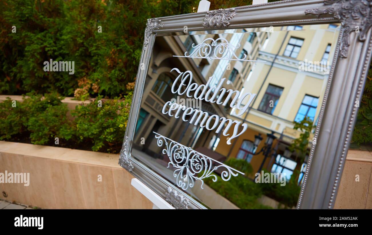 Wedding Ceremony Sign On Mirror and Decoration Stock Photo - Alamy