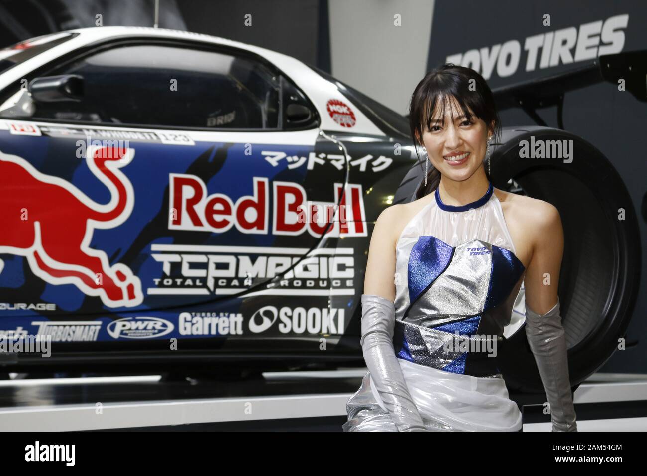 Chiba, Japan. 11th Jan, 2020. A booth assistant poses for a photograph ...