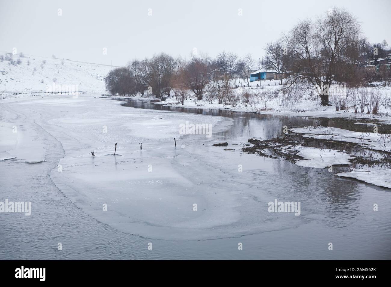 rustic winter scenery with river Stock Photo - Alamy