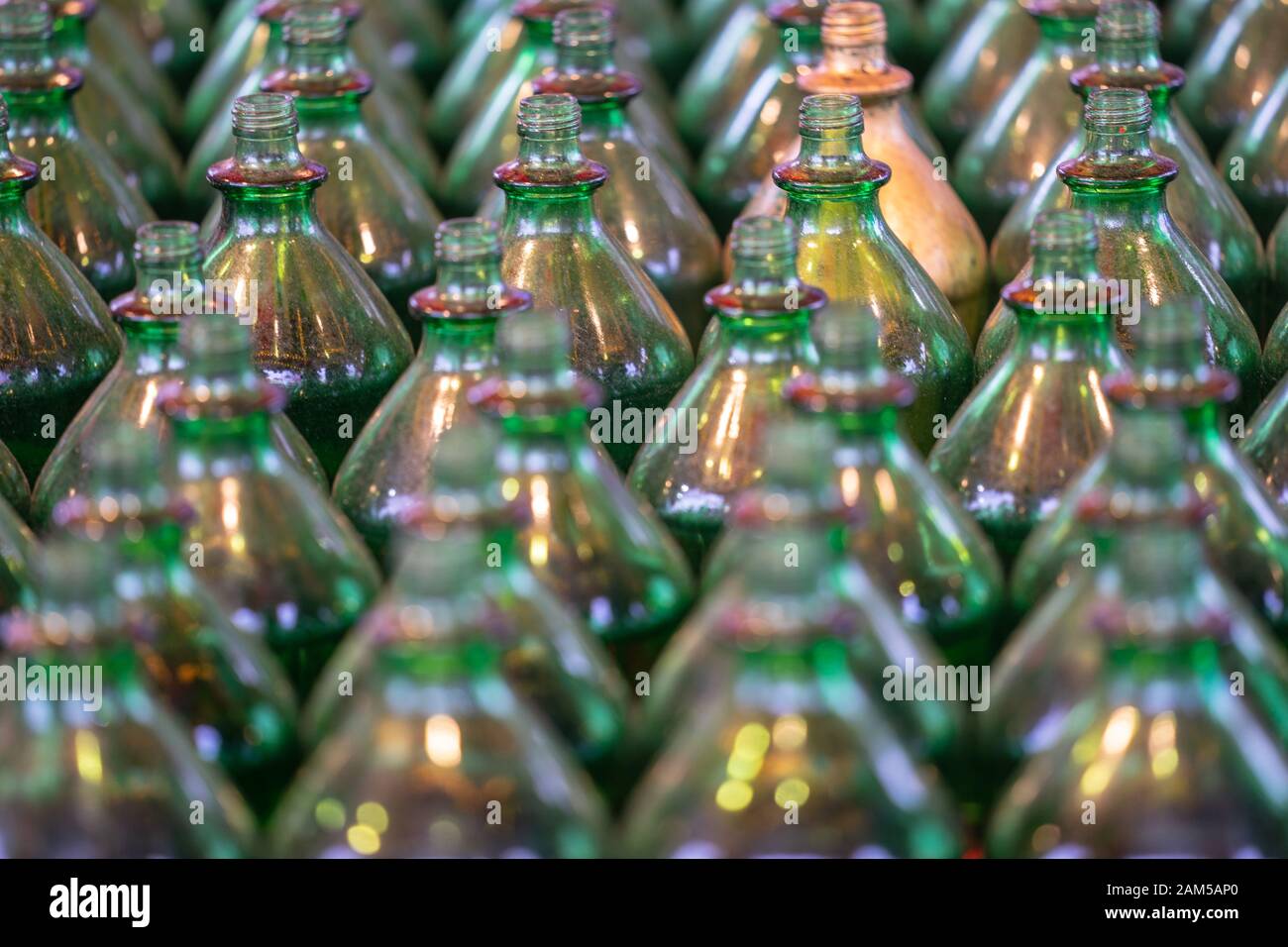 Glass bottles texture. A lot of green glass empty bottles, selective ...