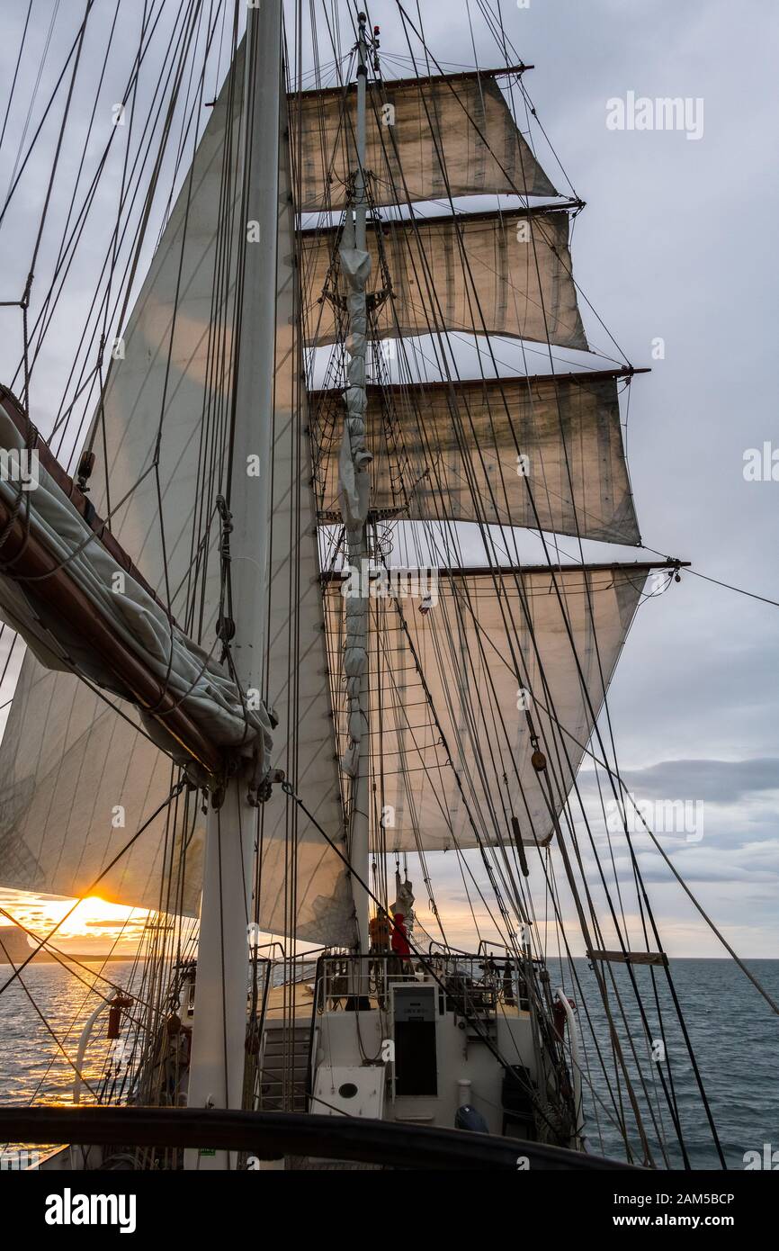 sun-flooded sails of a big sailboat Stock Photo - Alamy