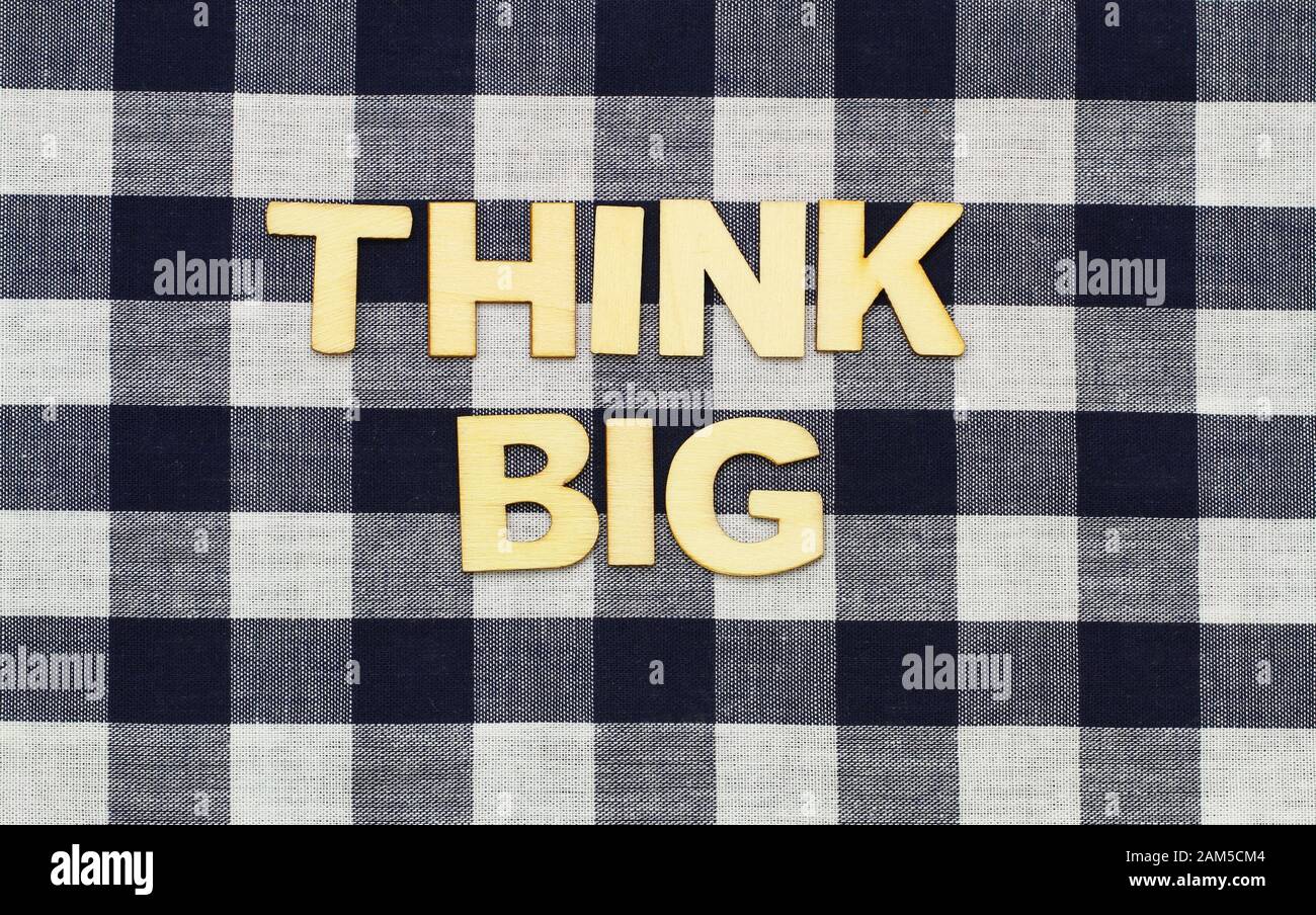 Think big written with wooden letters on checkered cloth Stock Photo ...