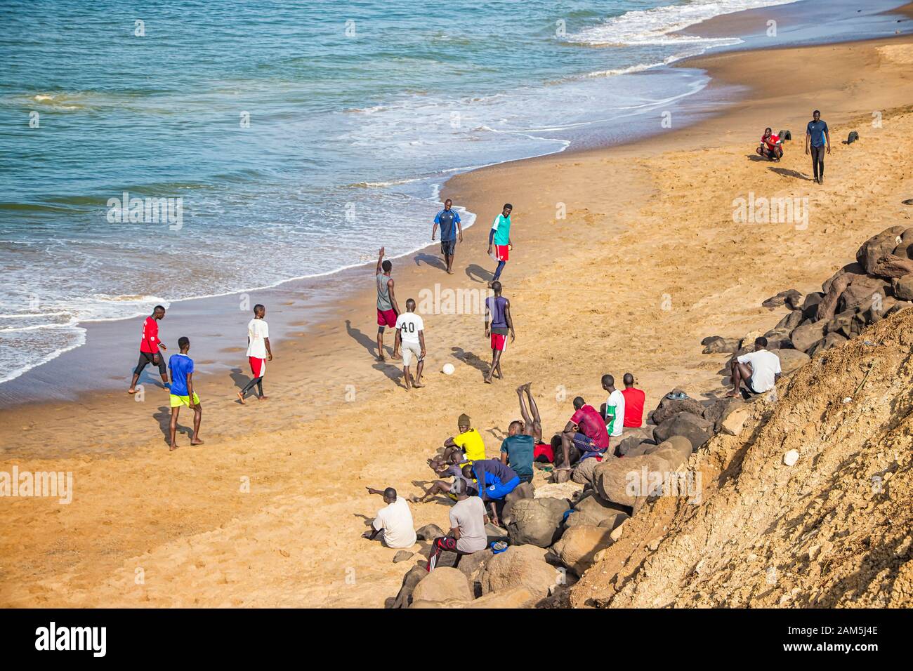 Dakar, Senegal- April 24 2019: Men playing football on the beach near ...