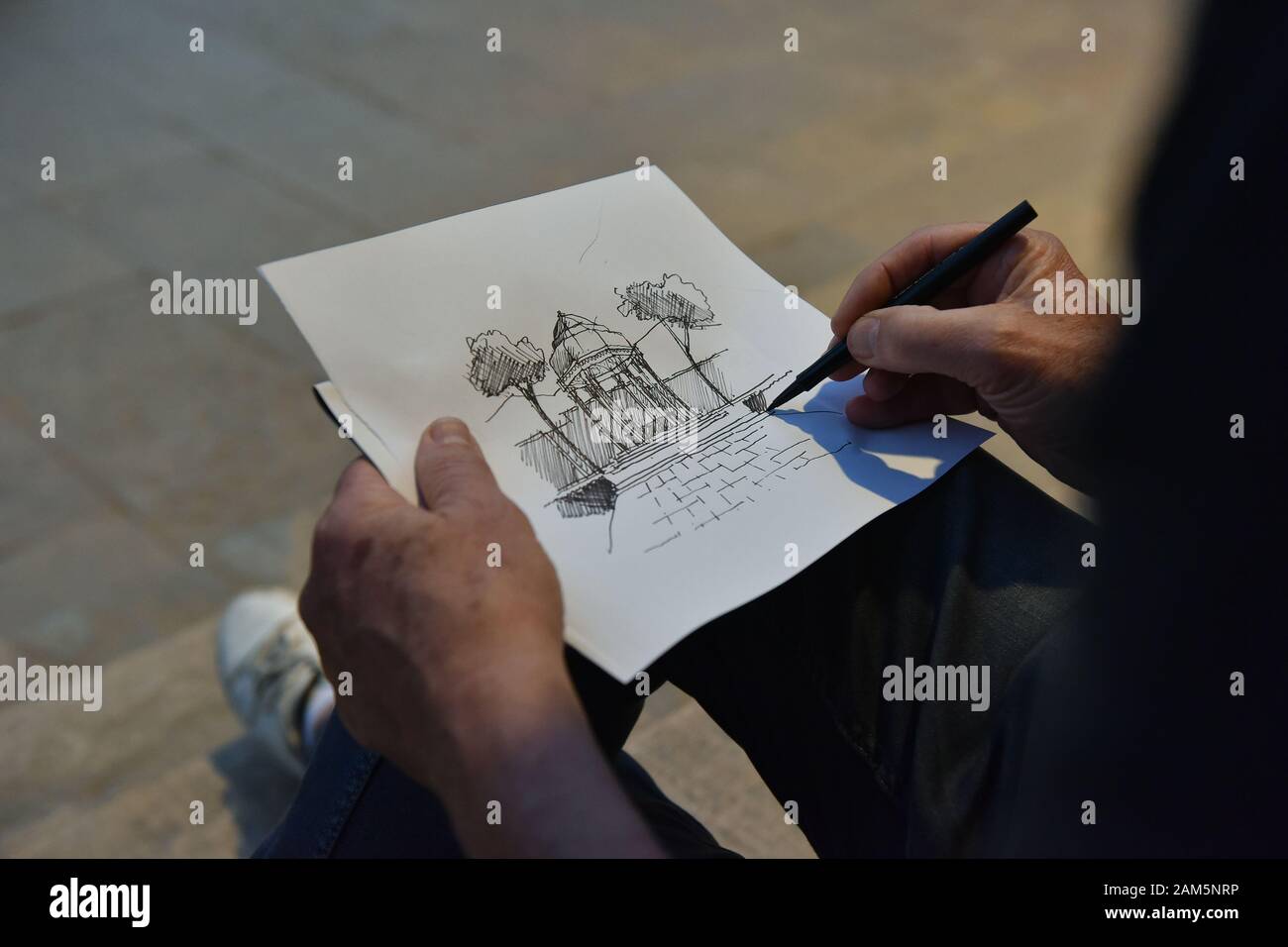 Iran, Shiraz city, Hafezieh. An artist is drawing sketch of Hafez tomb ...