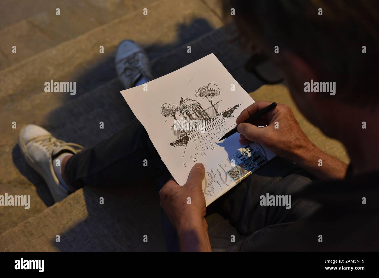 Iran, Shiraz city, Hafezieh. An artist is drawing sketch of Hafez tomb ...
