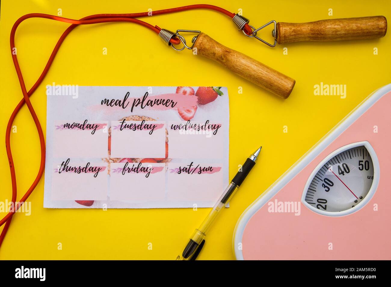 Modern weight scale with jumping rope - stock photo Stock Photo - Alamy