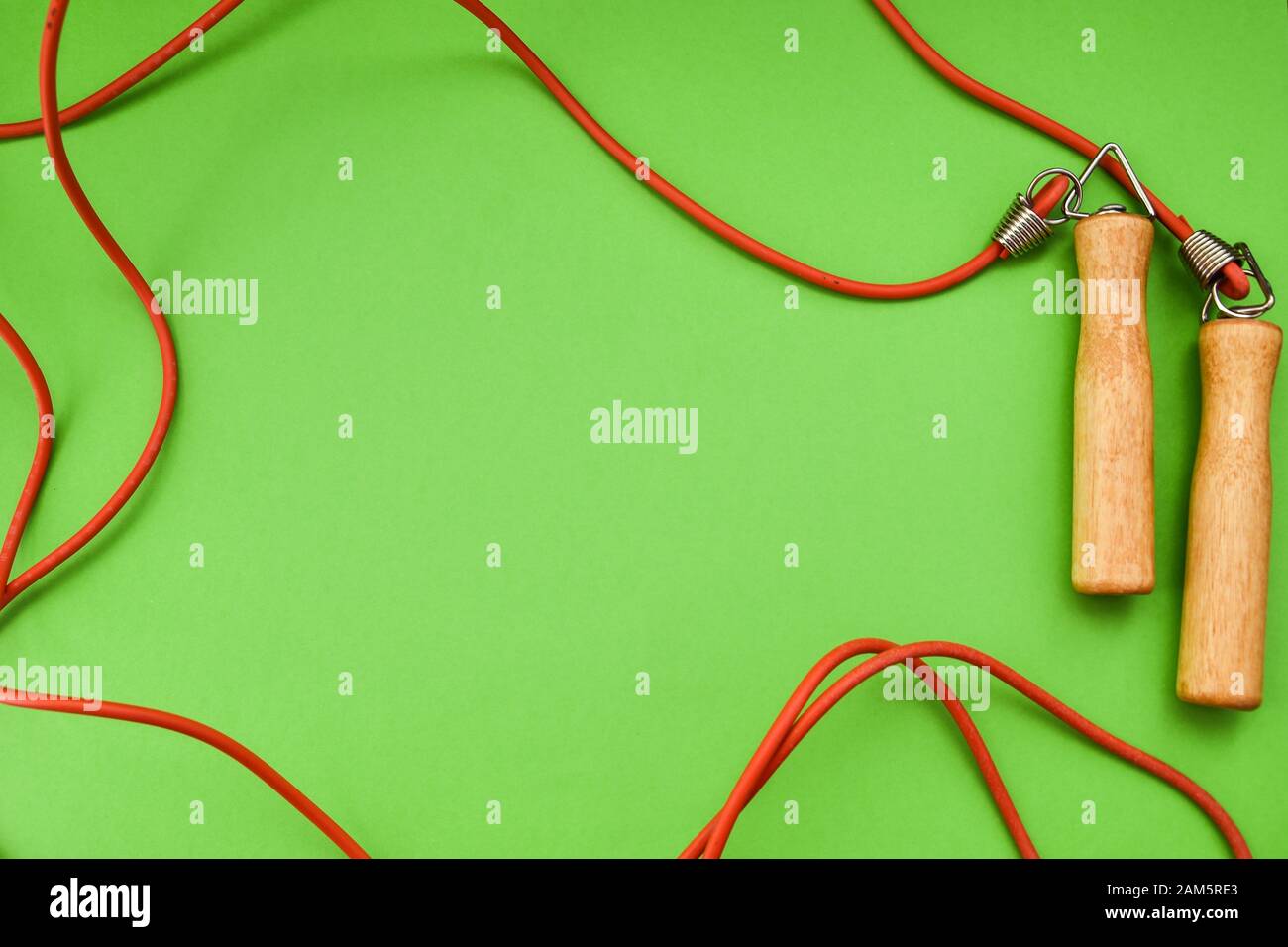 Jumping rope on yellow background - stock photo Stock Photo - Alamy