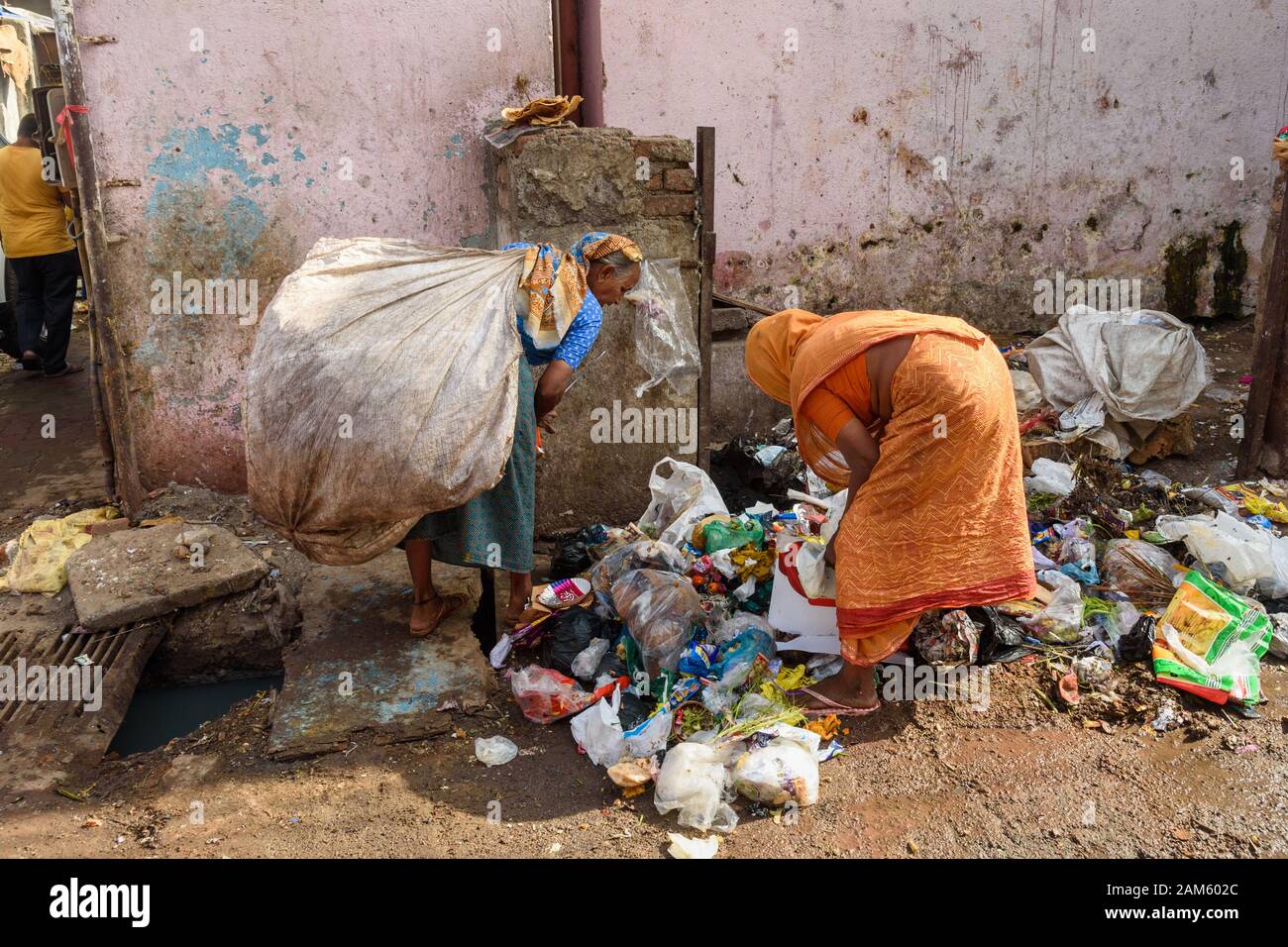 Indian women sorting garbage in Dharavi Slum at Mumbai. India Stock ...