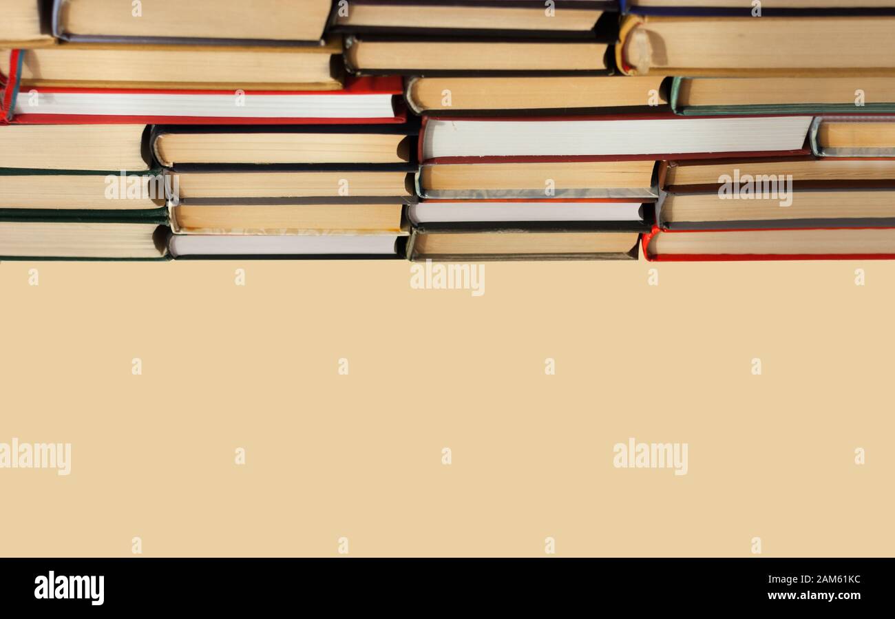stack of book on beige vanilla background, education concept, back to ...