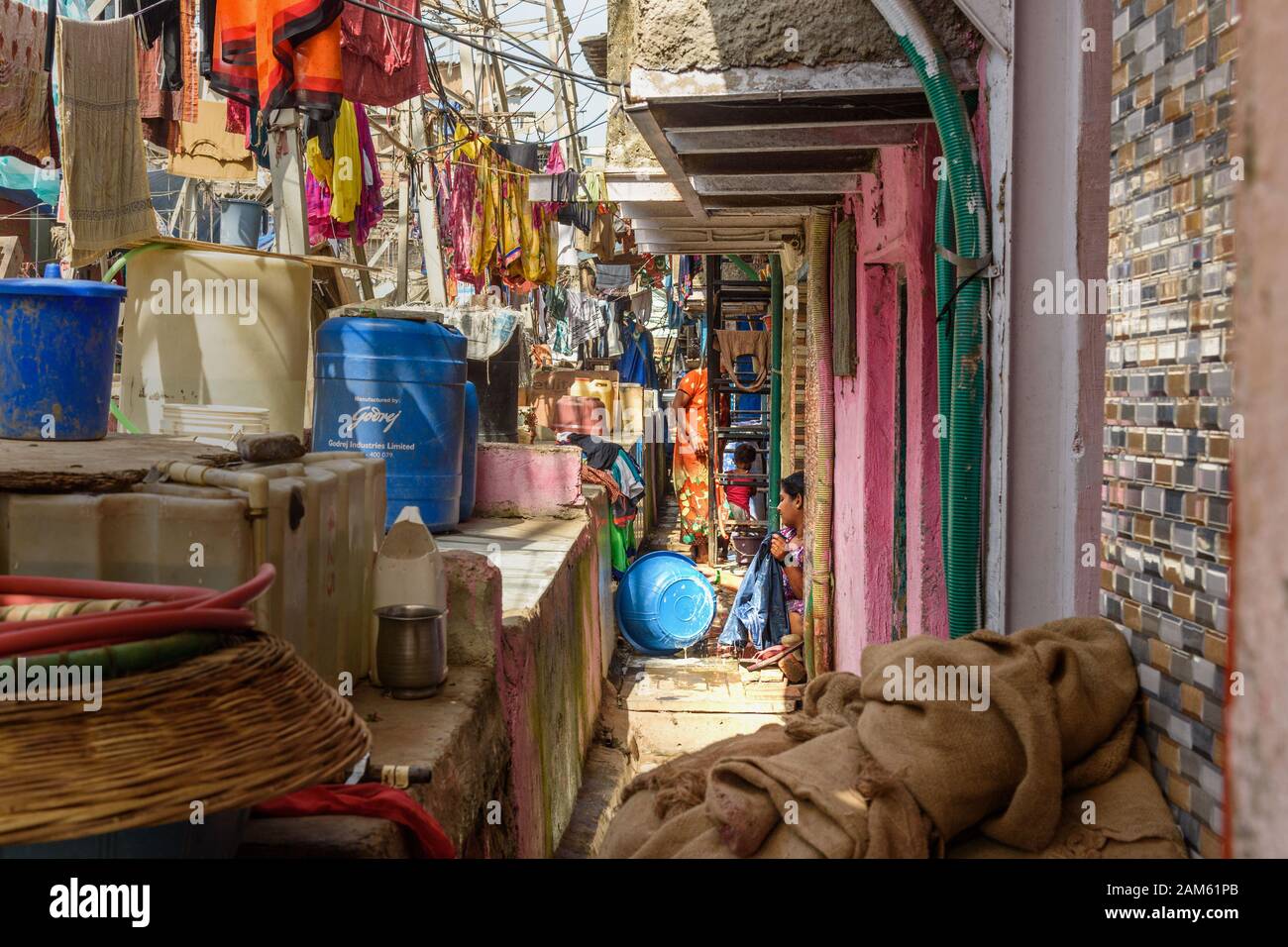 On the narrow street in Dharavi Slum at Mumbai. India Stock Photo - Alamy