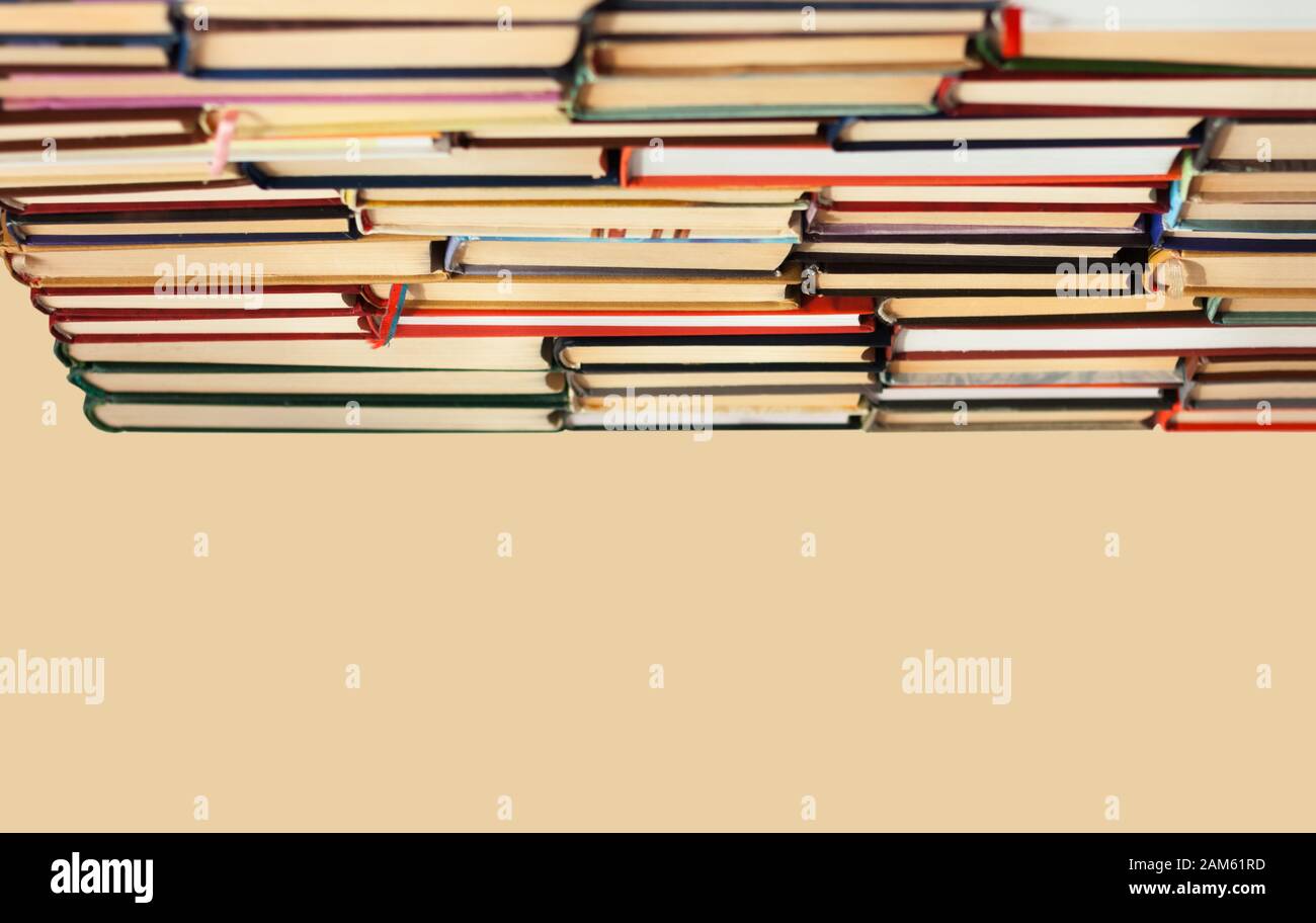 stack of book on beige vanilla background, education concept, back to ...