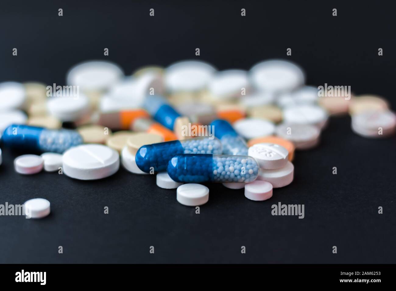 Heap of colorful pills, pharmaceutical medicine tablets and capsules ...