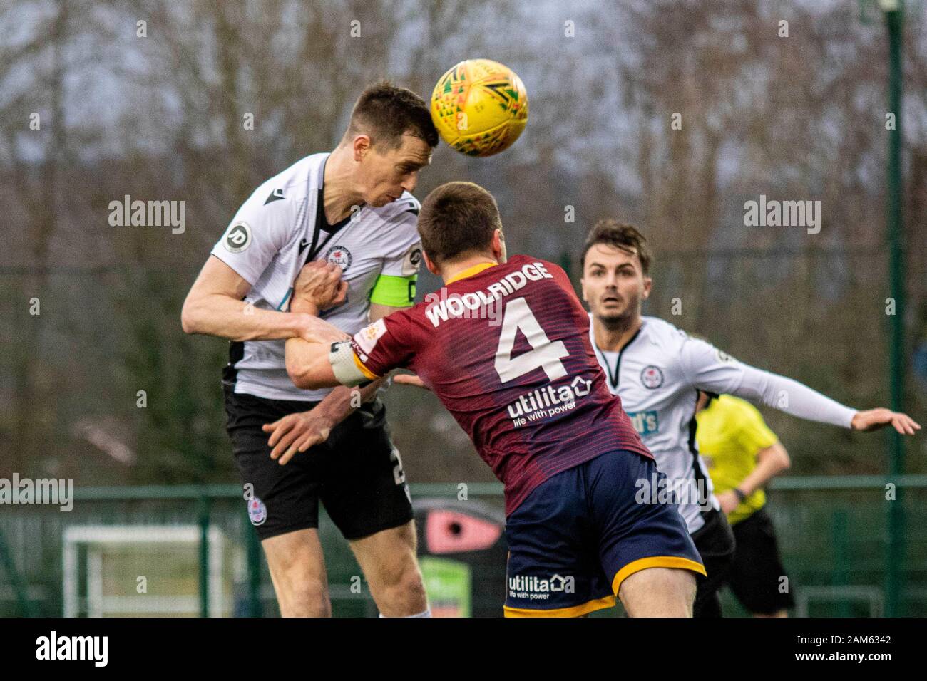 Chris Venables of Bala Town in action against Bradley Woolridge of ...