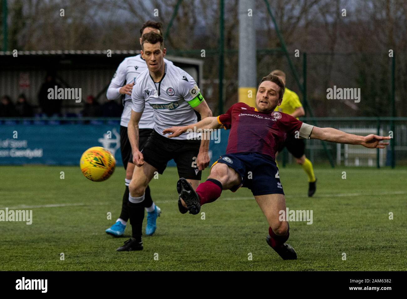 Chris Venables of Bala Town in action against Bradley Woolridge of ...