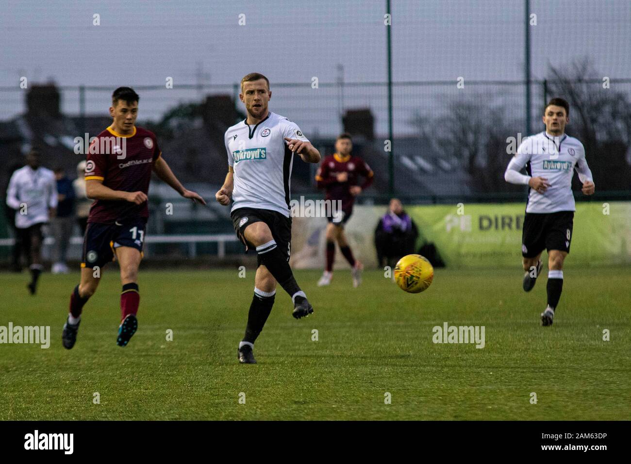 Anthony Stevens of Bala Town in action against Jordan Lam of Cardiff ...