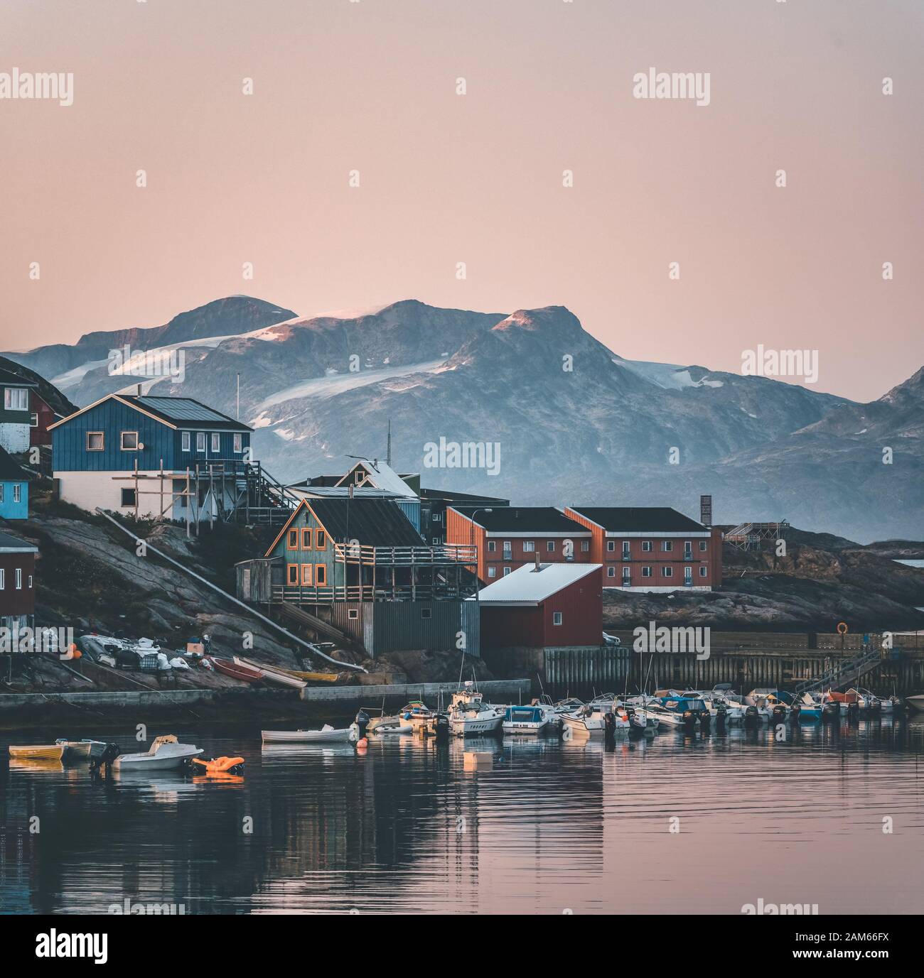 Sunset view of Maniitsoq arctic city in Greenland. Mountains in ...