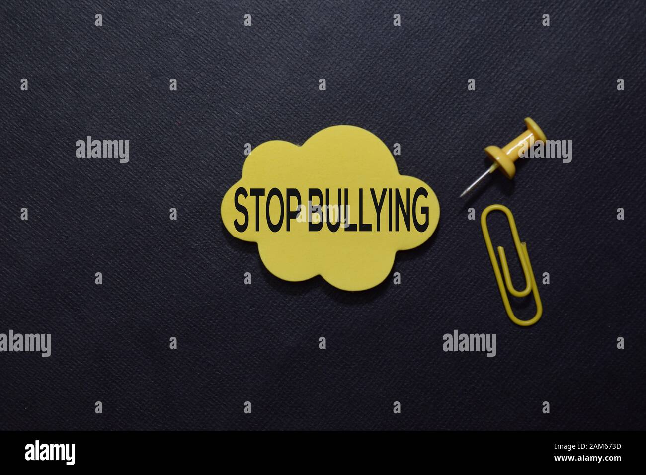 Stop Bullying write on sticky note isolated on black table Stock Photo ...
