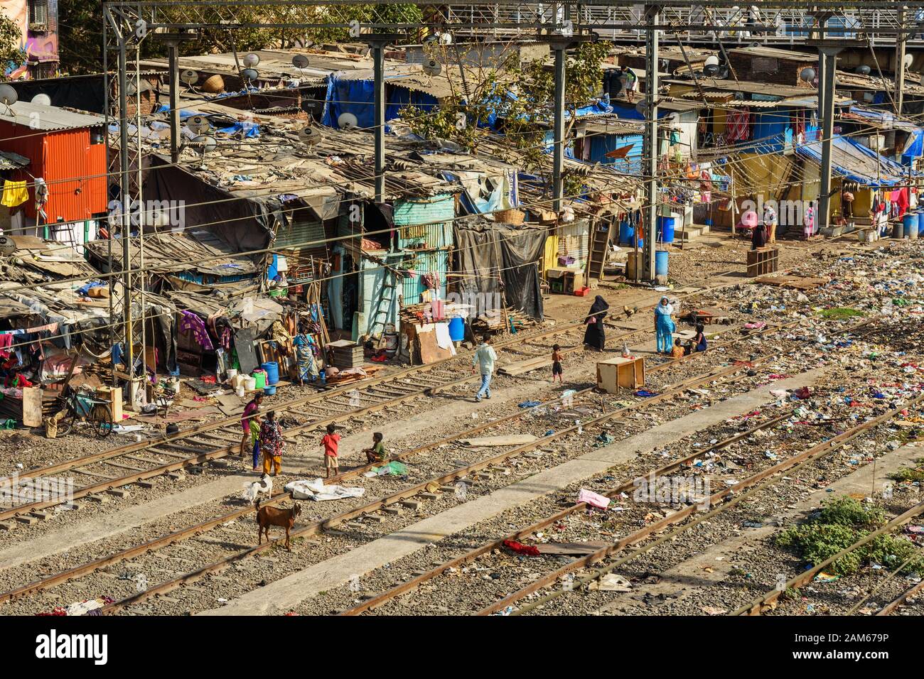 View of garbage slums poor area near Suburban Railway. Dharavi Slum at ...