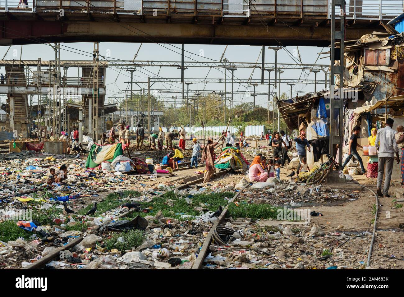 View of garbage slums poor area near Suburban Railway. Dharavi Slum at ...