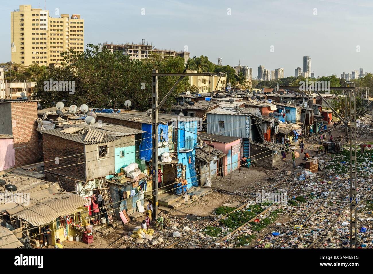 View of garbage slums poor area near Suburban Railway. Dharavi Slum at ...