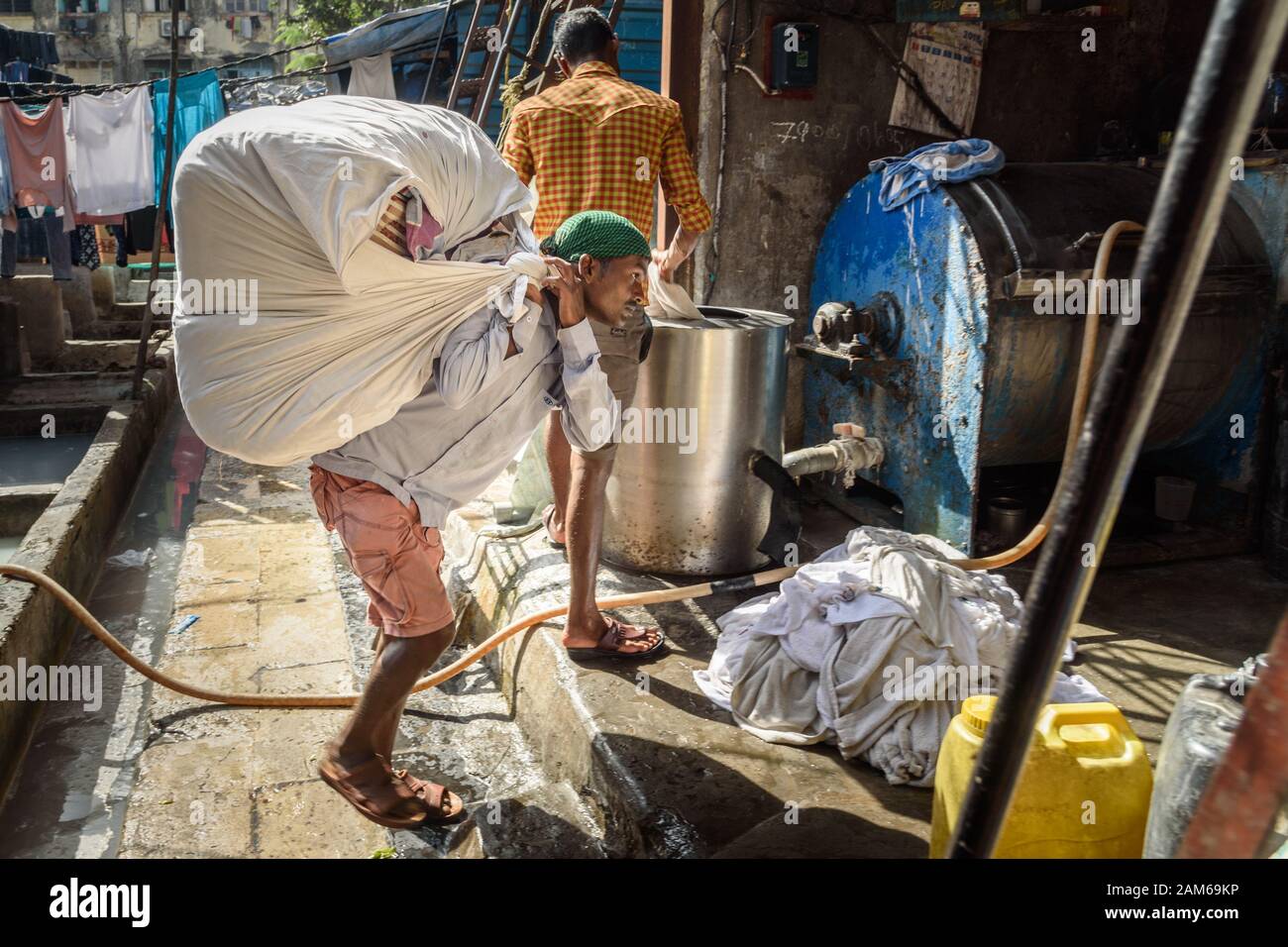 Work hard poor man carrying hi-res stock photography and images - Alamy