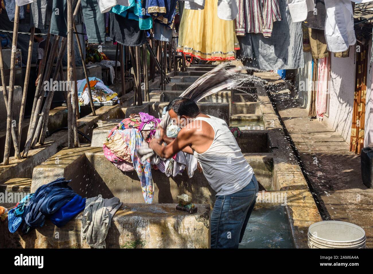 Indian worker washing large water hi-res stock photography and images ...