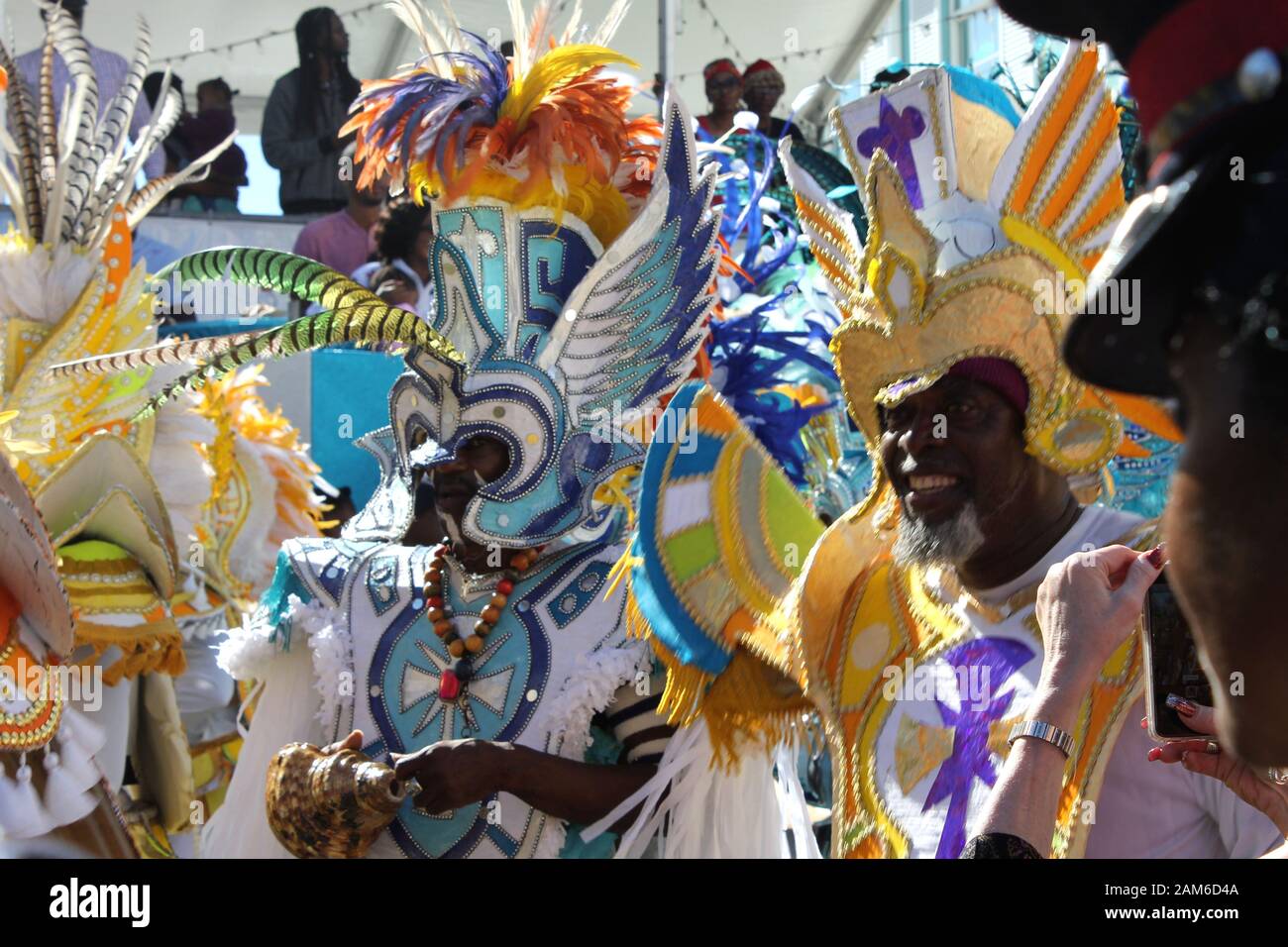 Men in bright colorful costumes at the Junkanoo street festival ...