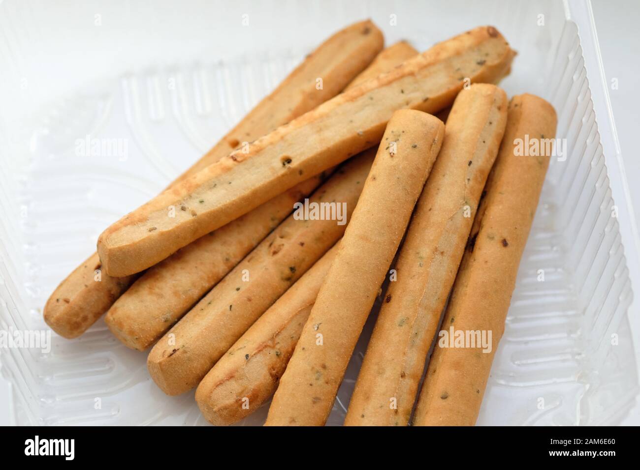 Delicious Italian bread sticks in plastic packaging. grissini snack top ...