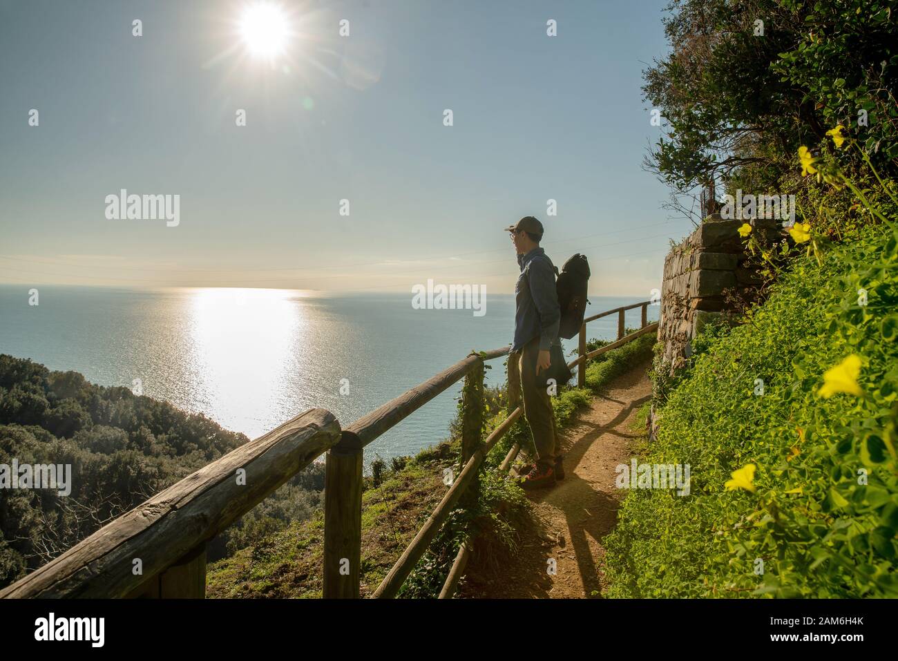 Chinese young man ( tourist ) watch to Mediterranean sea in Ligurian ...