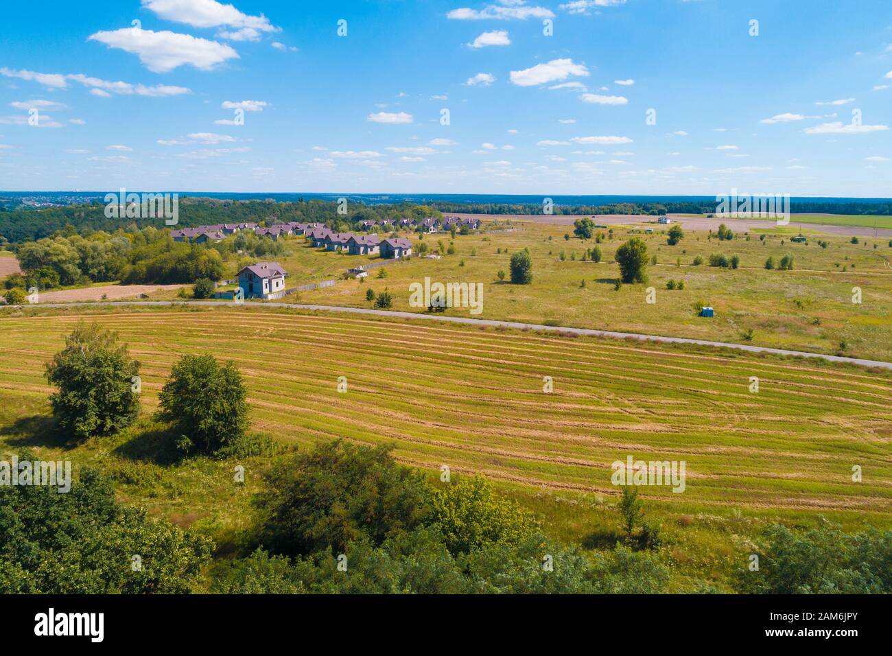Summer rural landscape, aerial view. View of the village, green fields ...