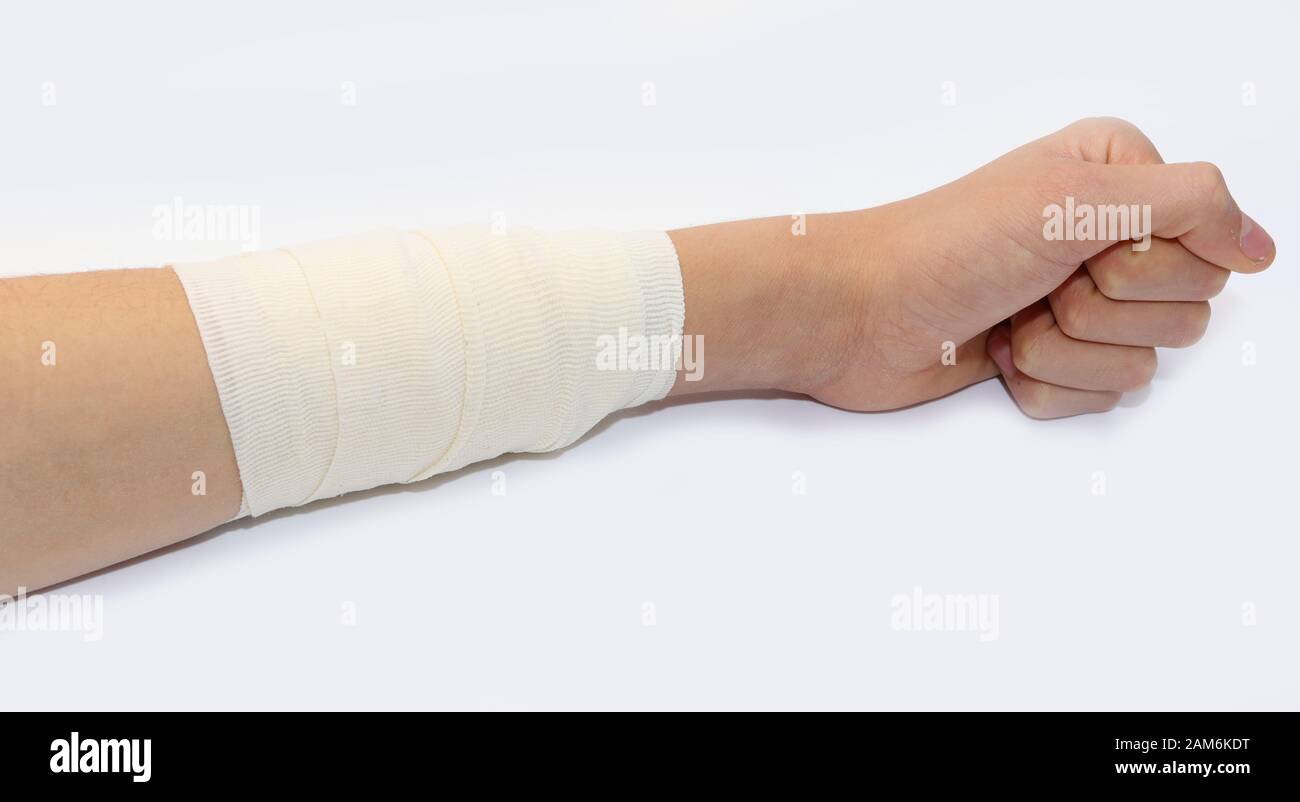 bandaged arm of the boy after the terrible burn on white background ...