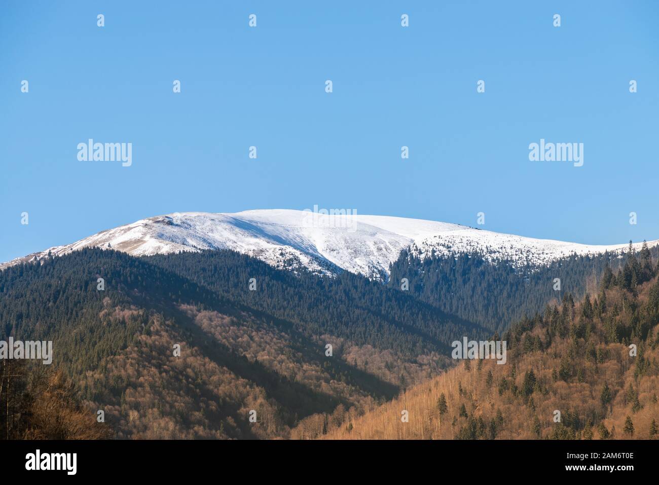 Photo of the Iezer-Papusa mountains with their snowy peaks and the ...