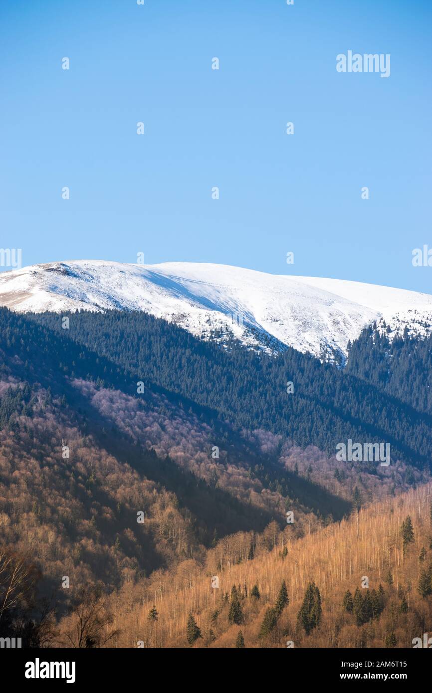 Photo of the Iezer-Papusa mountains with their snowy peaks and the ...
