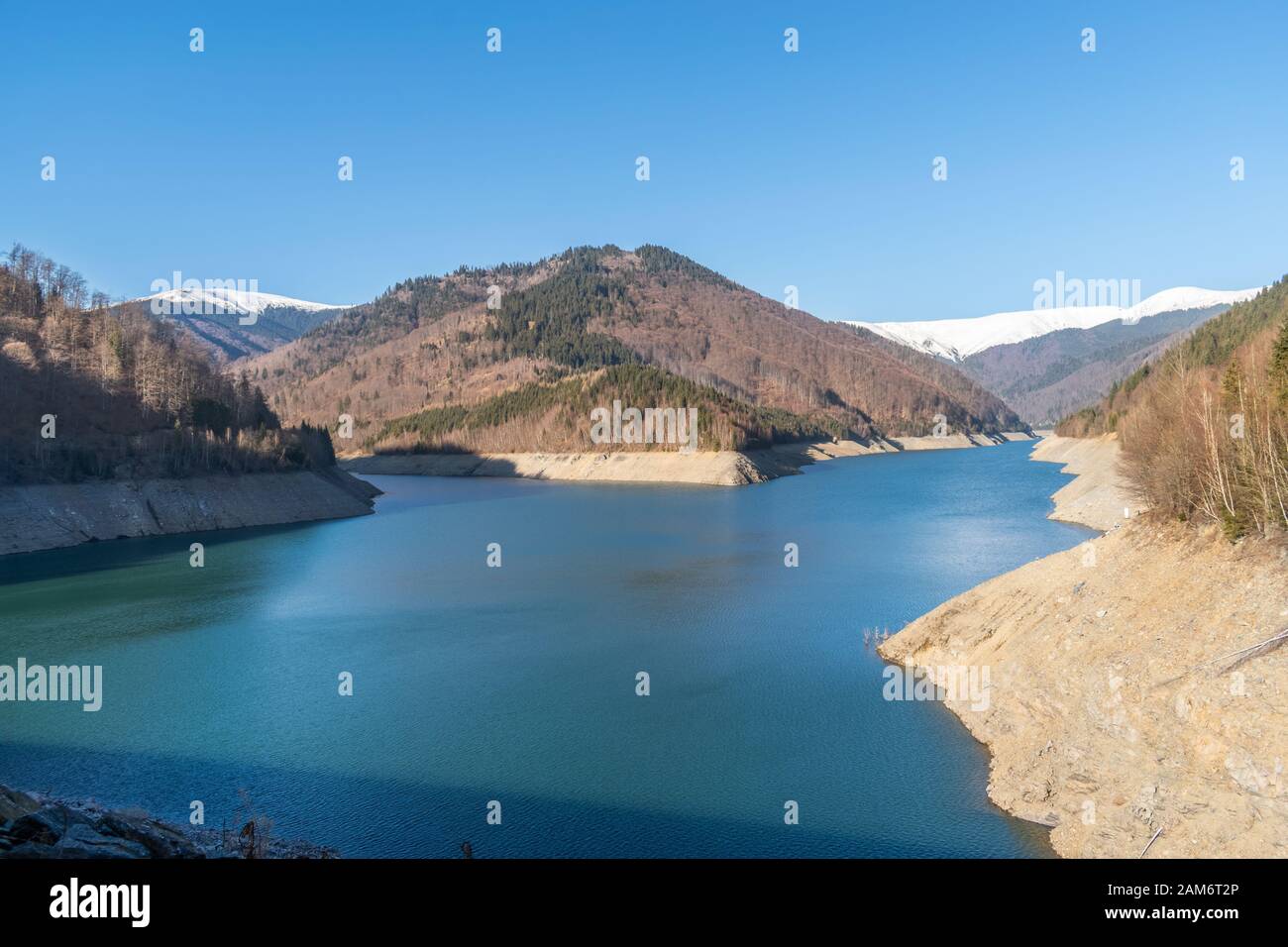 Photo of the Iezer-Papusa mountains with their snowy peaks and the ...