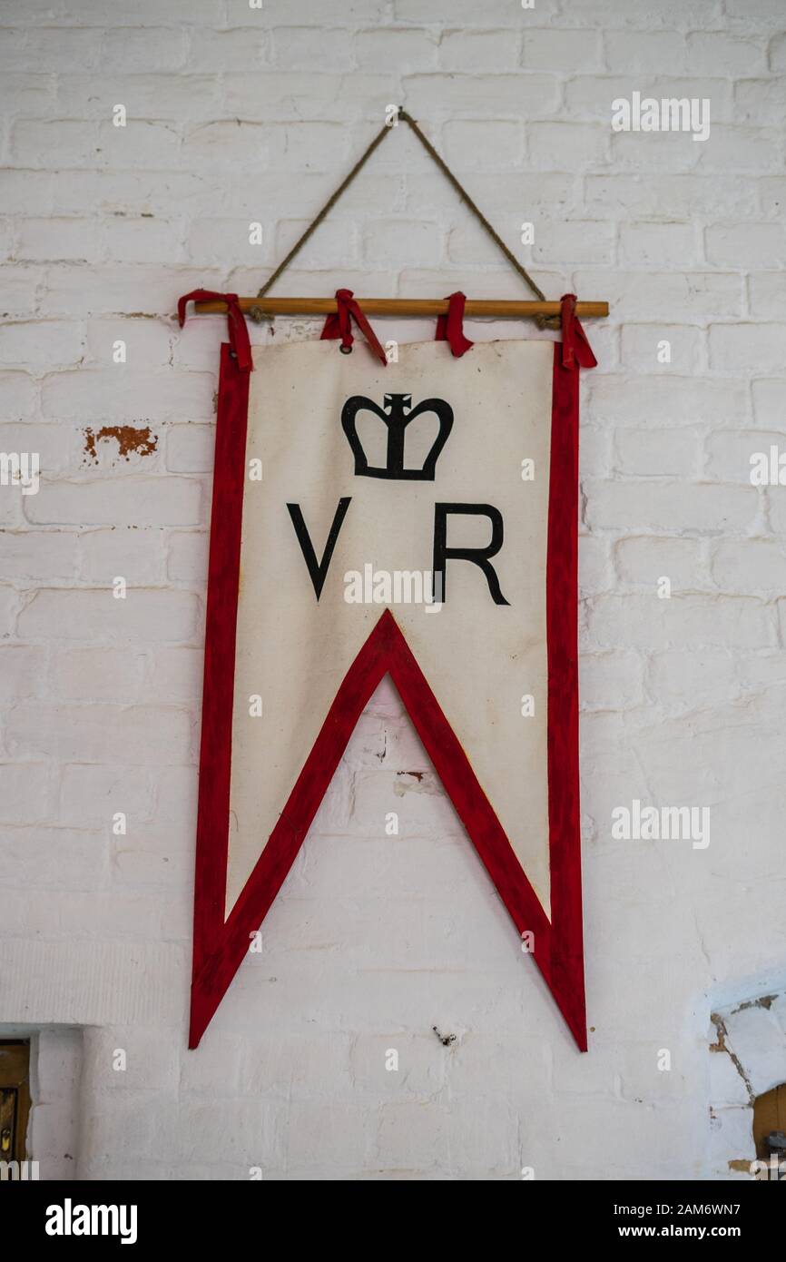 An old flag with V R and a crown on representing queen Victoria or ...