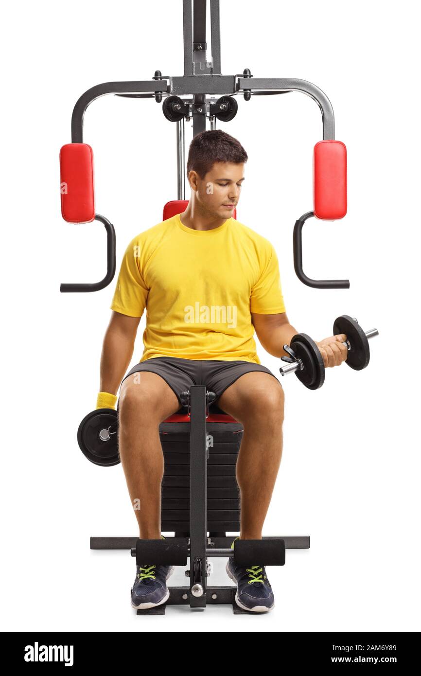Guy exercising on a fitness machine isolated on white background Stock ...