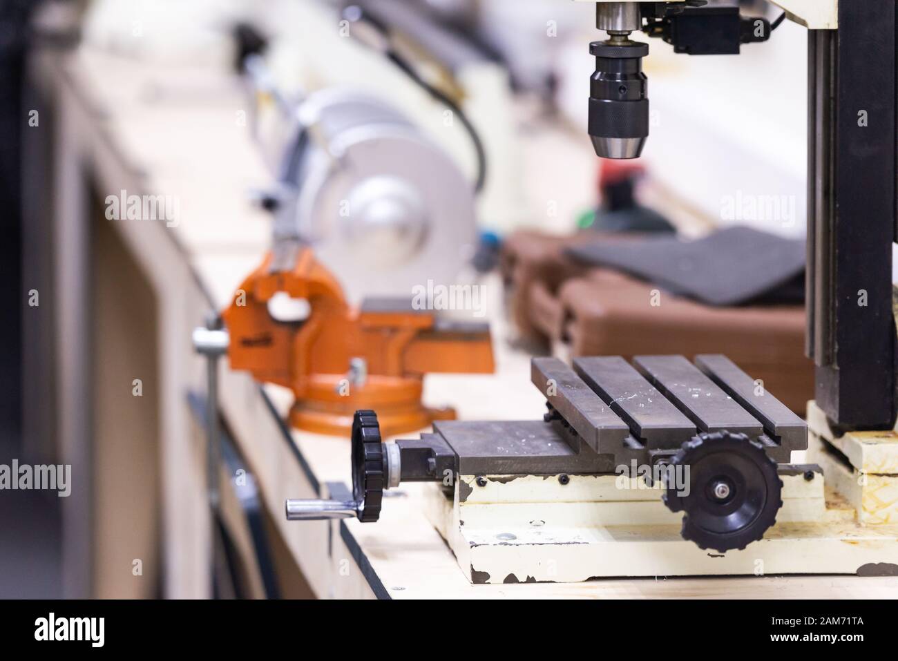Drilling machine. Work Desk in the workshop Stock Photo - Alamy
