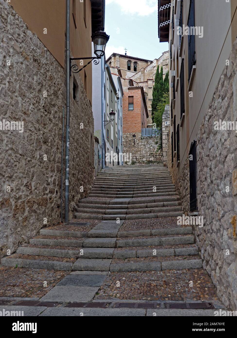 historic white stone buildings and ironwork lantern brackets in old ...