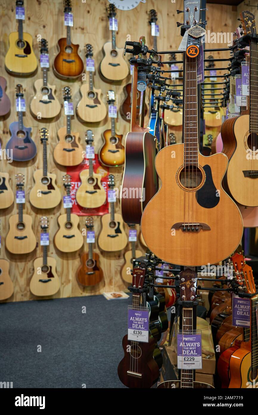 Guitars on sale in a shop in Cardiff, South Wales Stock Photo - Alamy