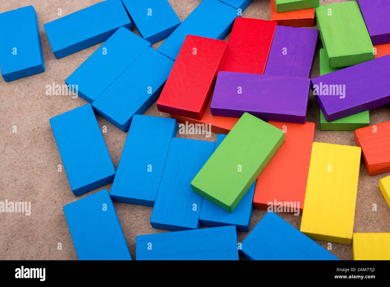 Wooden blocks of various color randomly scattered Stock Photo - Alamy