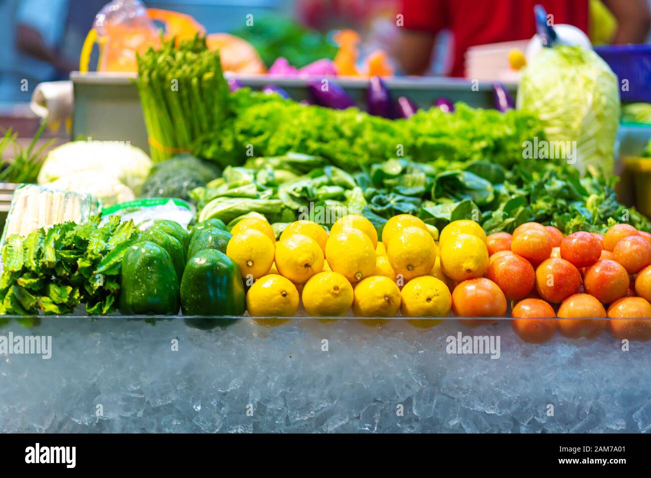Fresh colored vegetables on a street food store counter Stock Photo - Alamy