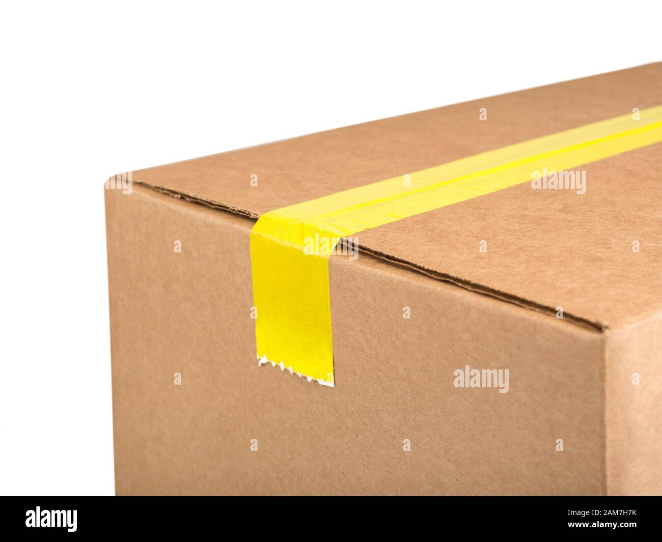 Closeup of cardboard box with sticky tape isolated on white background ...