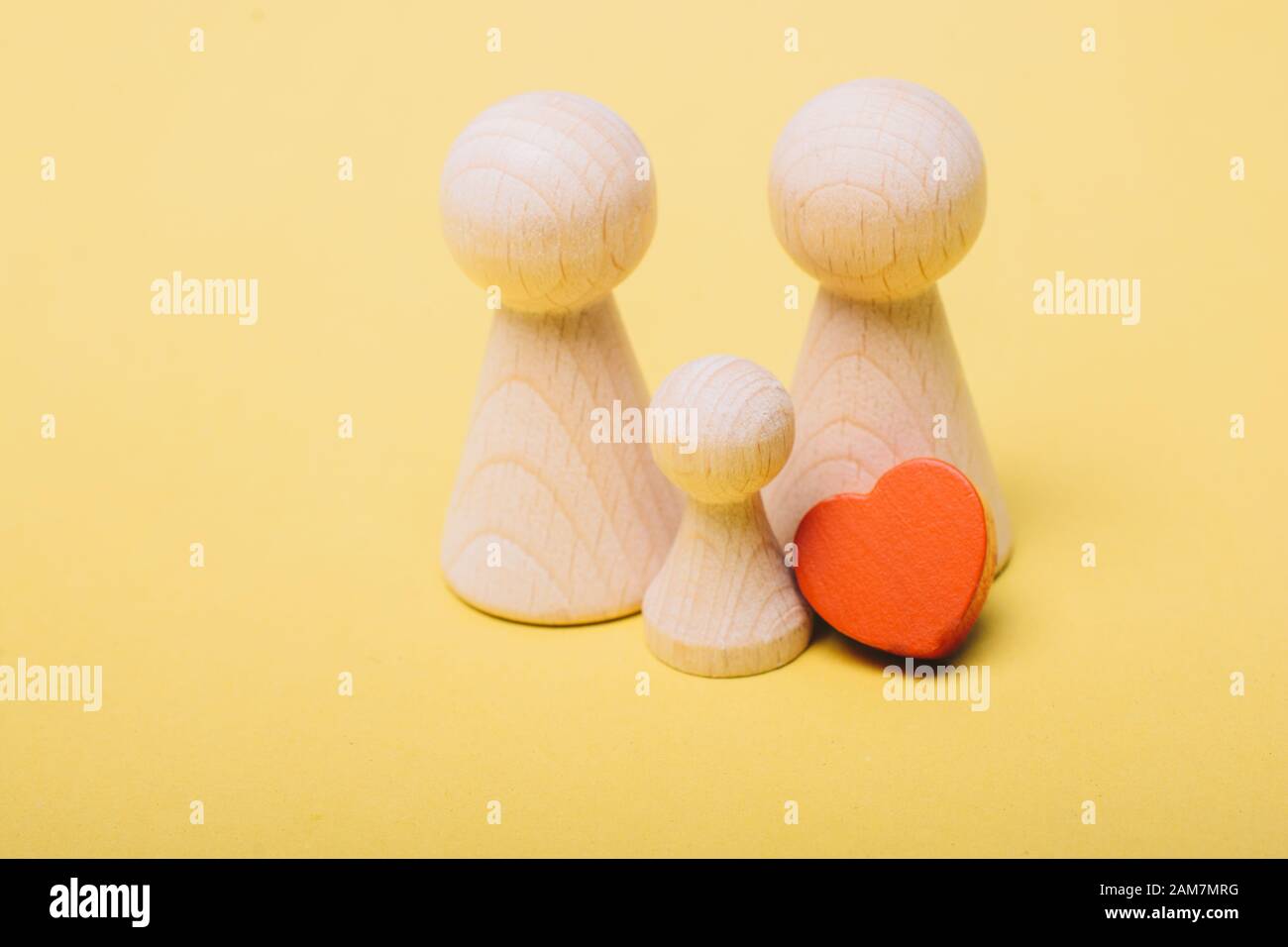 Wooden figurines of family as concept of caring for children Stock ...