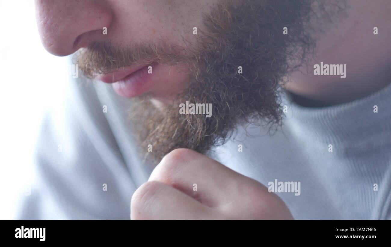 Bearded man twirling his ridiculously long mustache Extreme close up ...