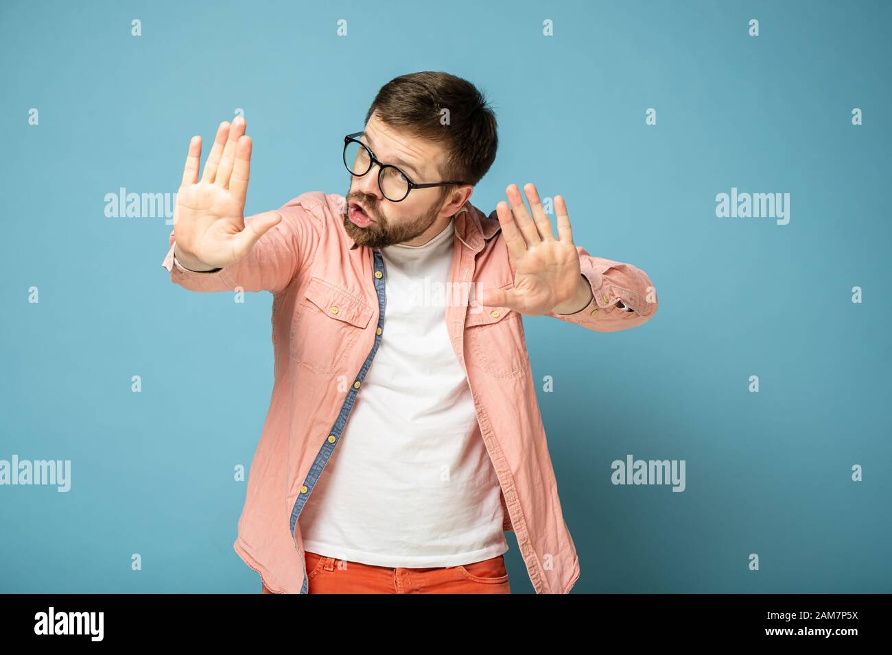 Man hand holding stop sign hi-res stock photography and images - Alamy
