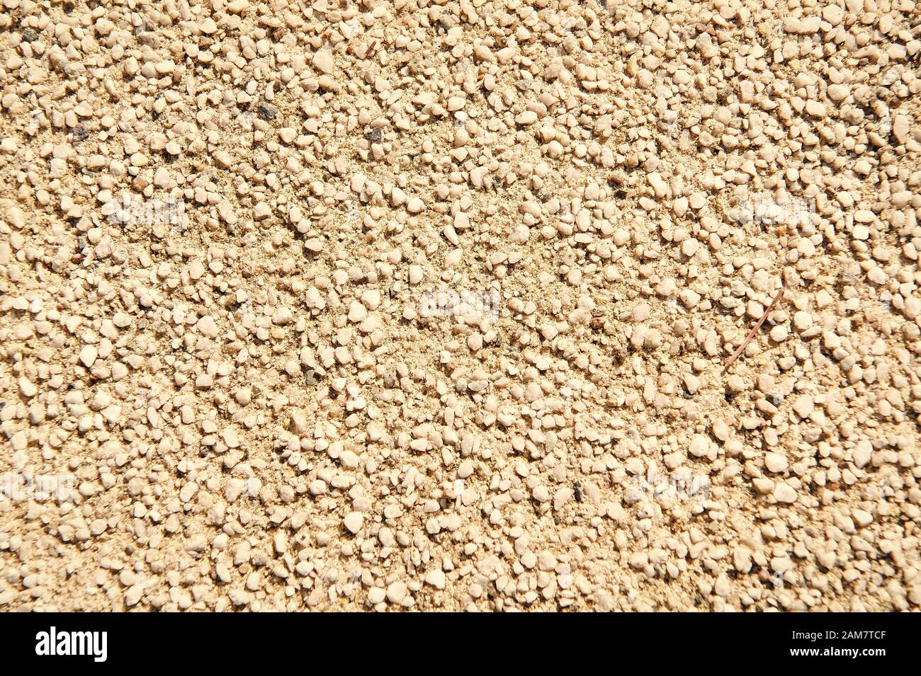 Rough and uneven. Sand and stone surface. Sandy stone texture. Gravel ...